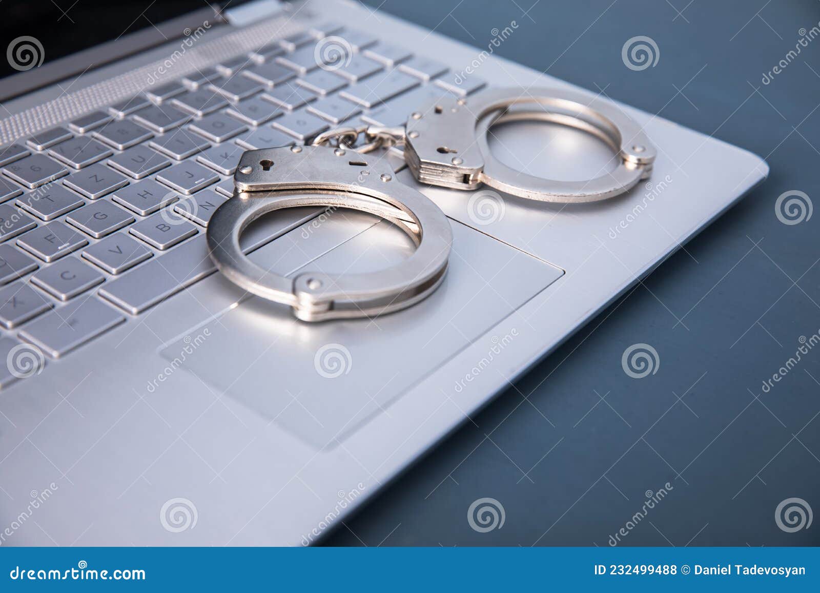 Handcuffs on the computer stock photo. Image of network - 232499488