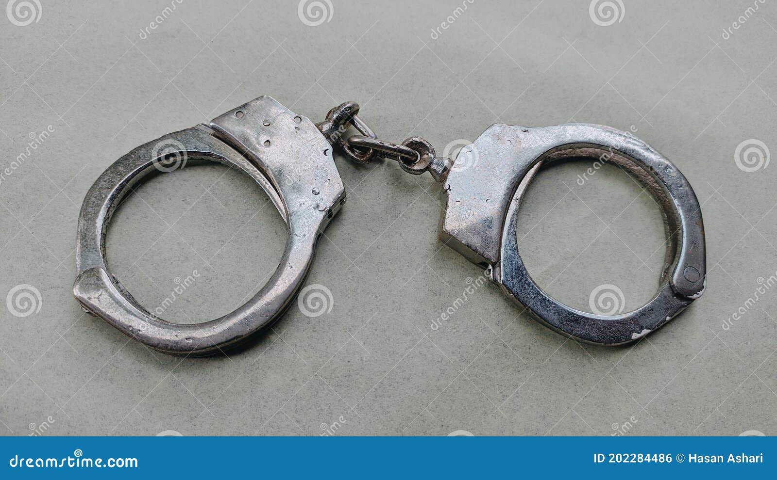 Handcuffs on a Gray Background Stock Photo - Image of police, handcuffs ...