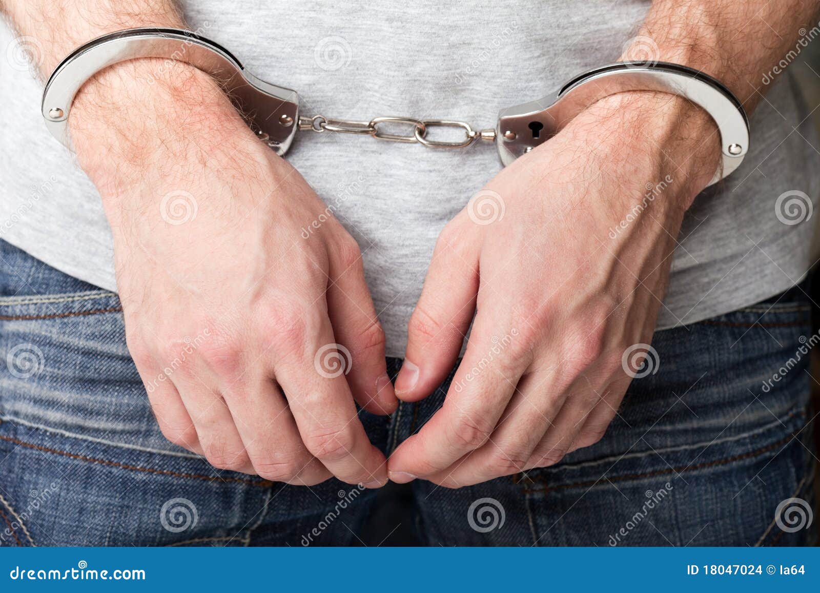 Handcuffs on hands stock photo. Image of busted, detain - 18047024 Handcuffs on hands stock photo. Image of busted, detain - 18047024
