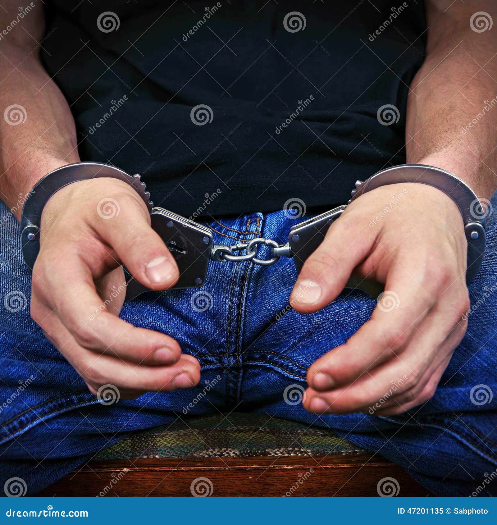 Handcuffs on Hands closeup stock image. Image of lock - 47201135
