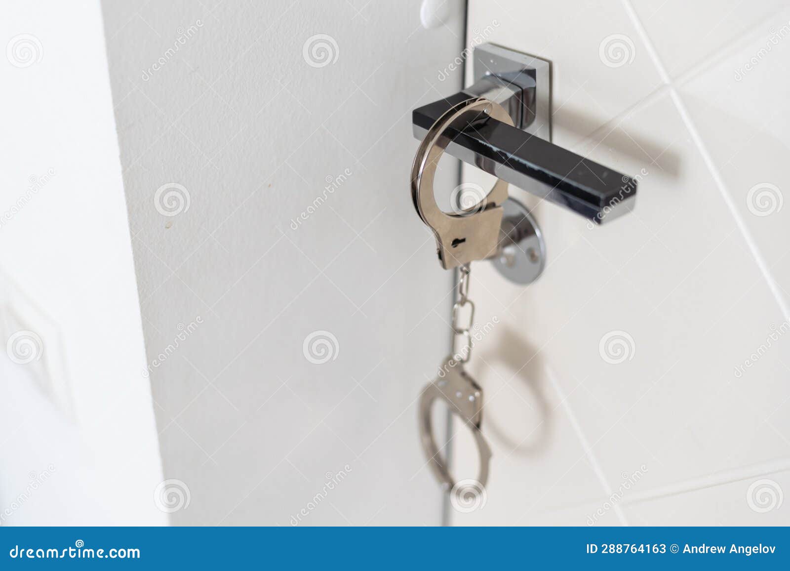 Handcuffs Hanging on the Door Stock Image - Image of manacle, kinky ...