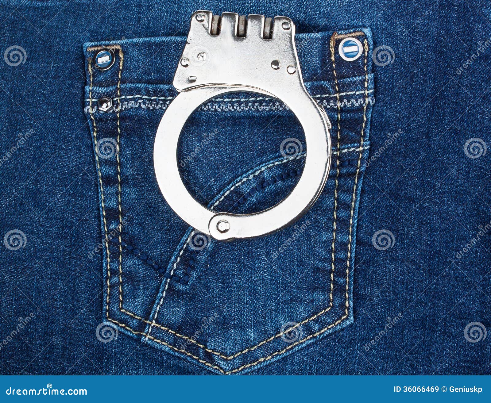 Handcuffs in jeans pocket stock image. Image of detail - 36066469