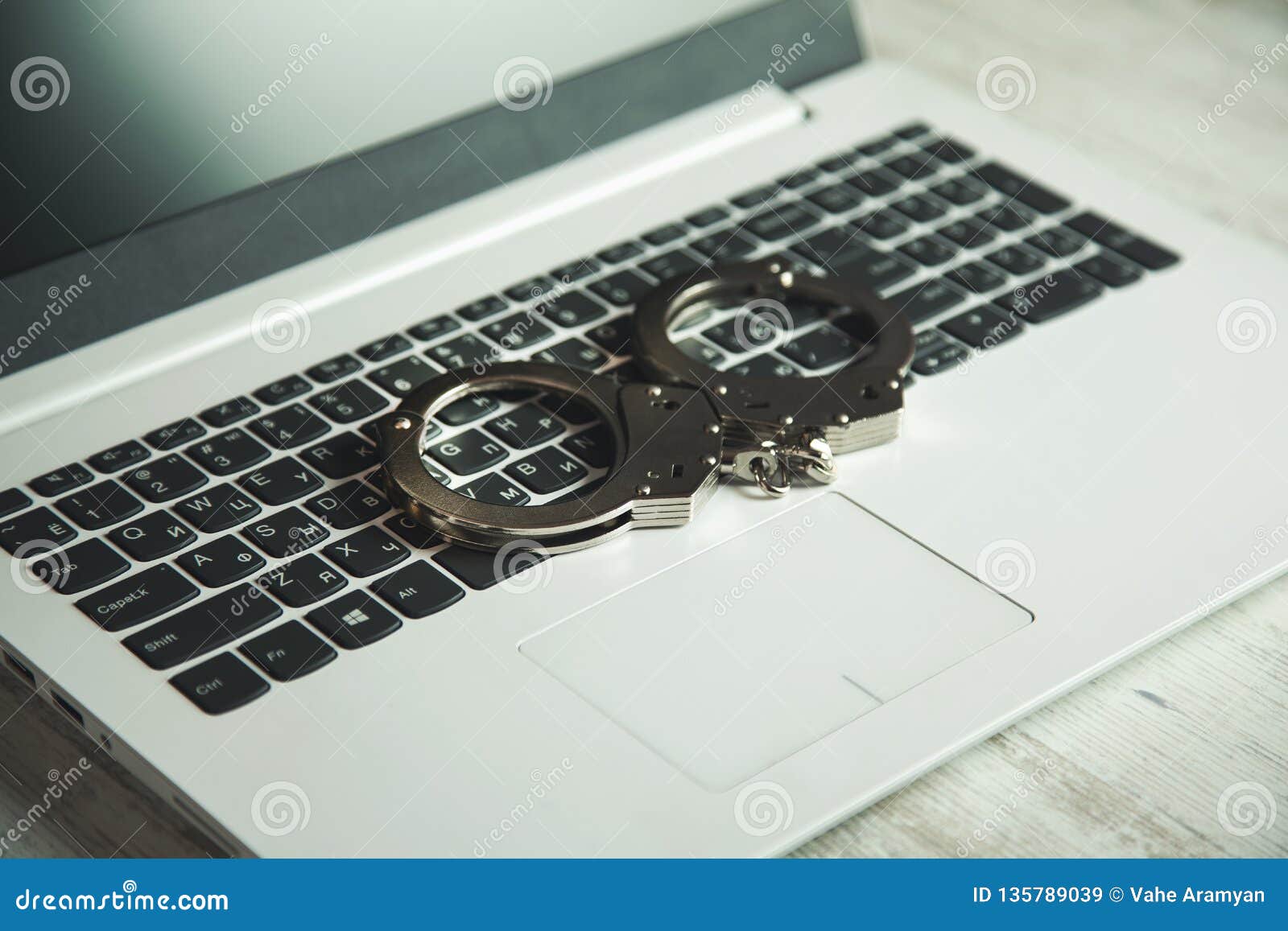 Handcuffs on keyboard stock image. Image of corporate - 135789039