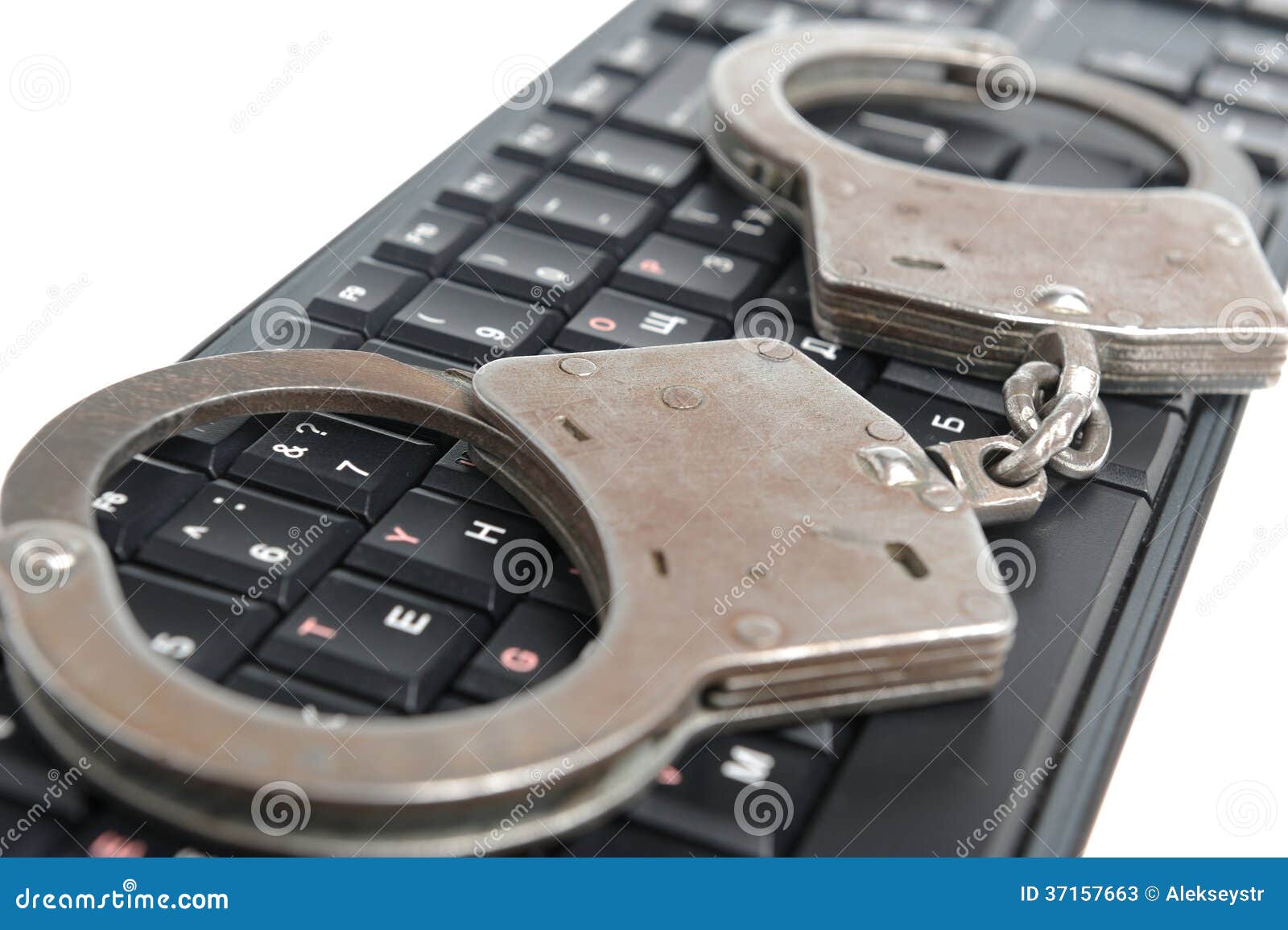 Handcuffs on the Keyboard on White Background Stock Image - Image of ...