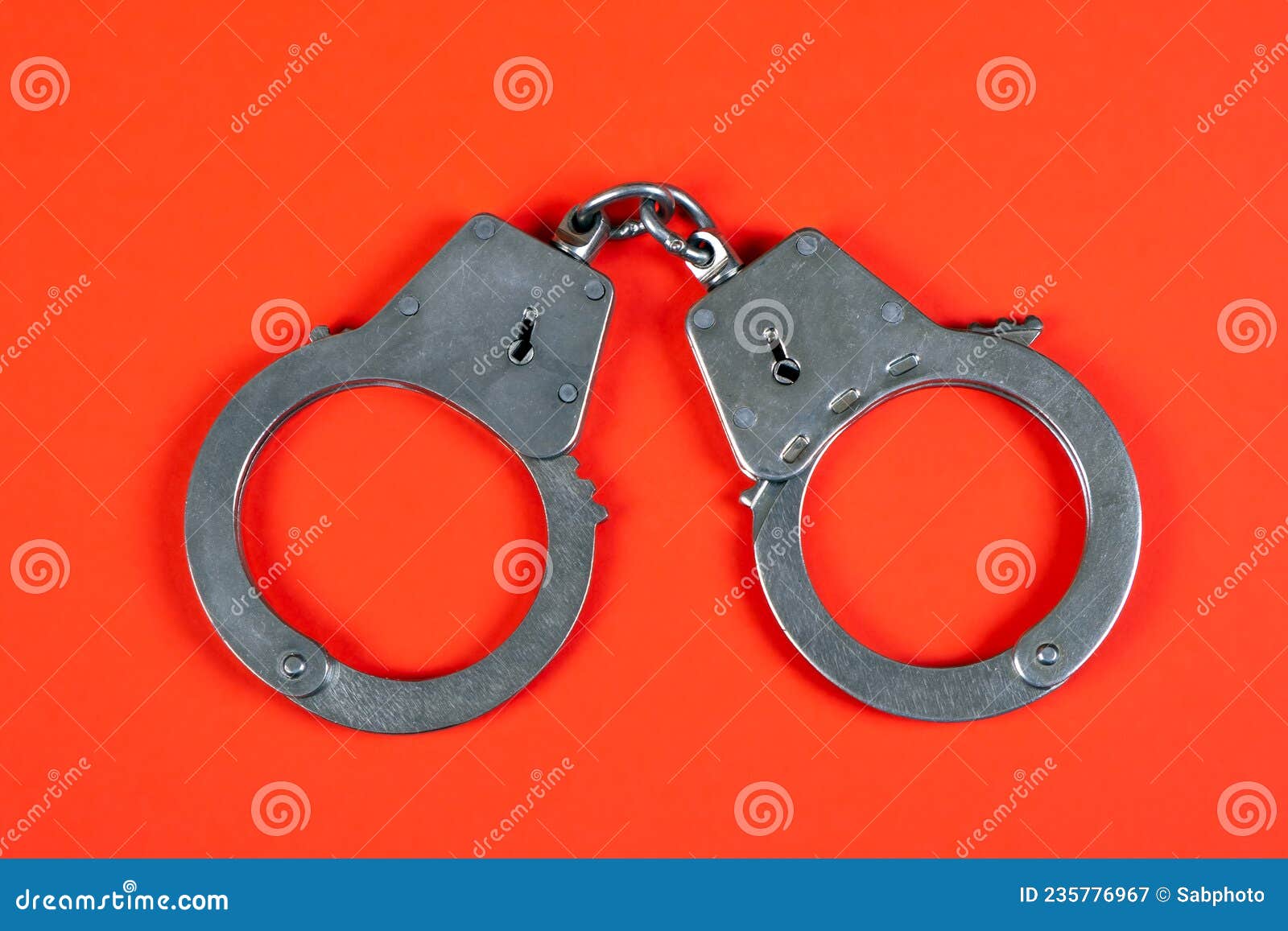 Handcuffs on the Red Paper stock image. Image of pair - 235776967