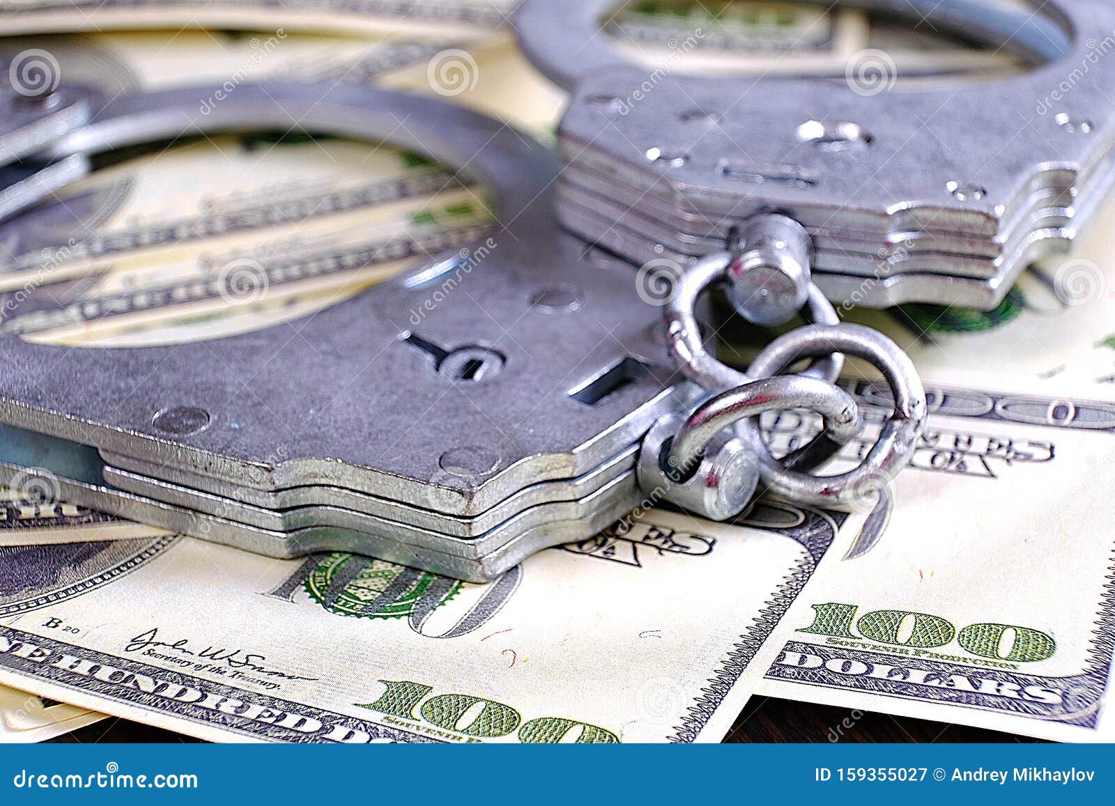 Handcuffs on a Stack of Money. Criminal Earnings. Business Concept. the ...