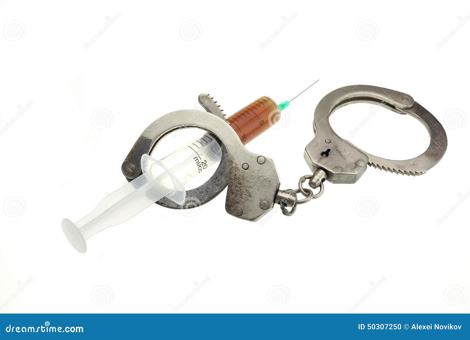 Handcuffs and Syringe with Brown Liquid Isolated Stock Photo - Image of ...