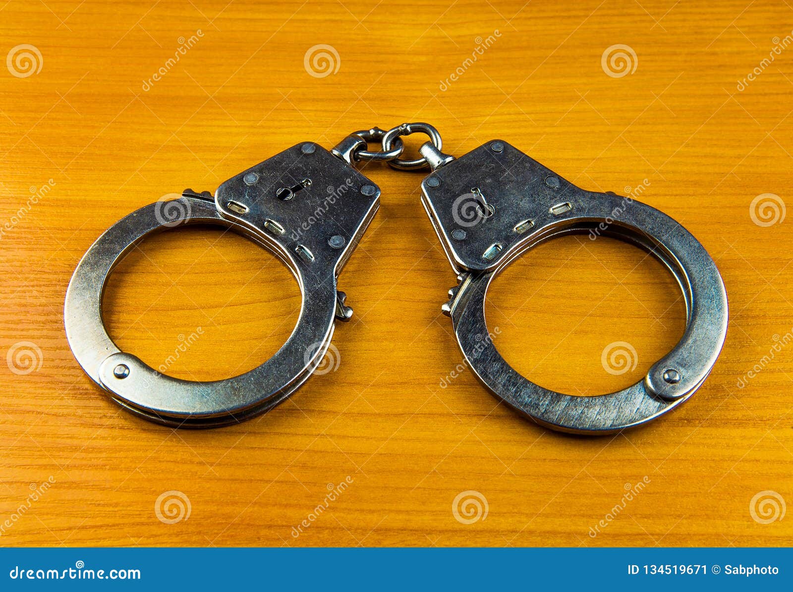 Handcuffs on the Table stock image. Image of cuffs, table - 134519671