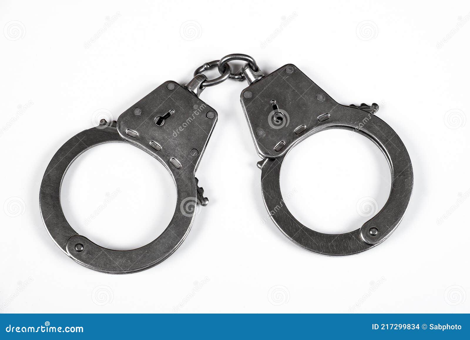 Handcuffs on the White stock photo. Image of cuffs, punishment - 217299834