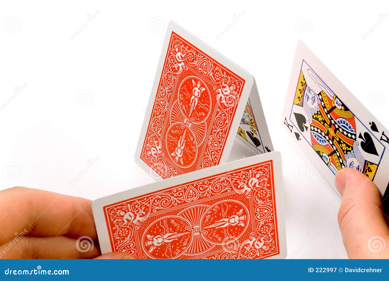 Handen Die Een Kaartenhuis Bouwen Stock Afbeelding - Image of koning ...