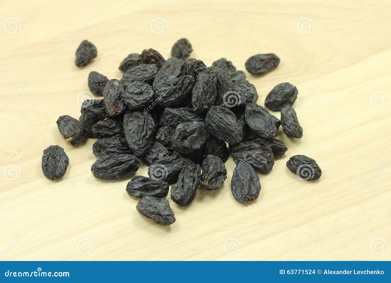 A handful of black raisins stock photo. Image of diet - 63771524