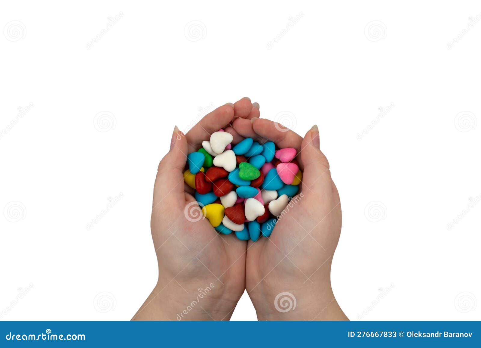 A Handful of Multi-colored Heart-shaped Sweets in Hands Stock Image ...
