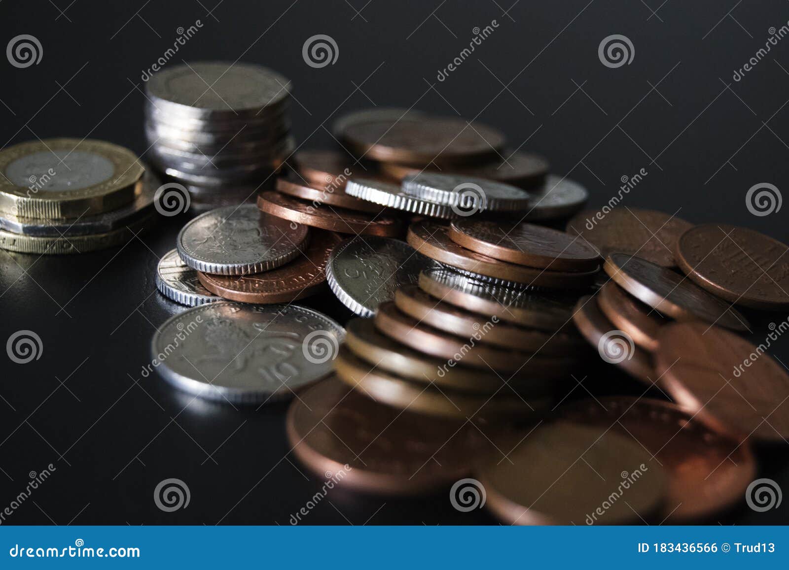 Coins on tabletop stock photo. Image of varied, great - 183436566