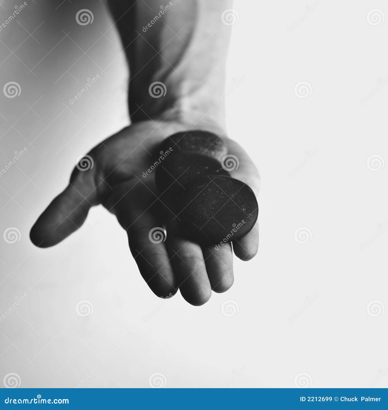Handful of rocks stock image. Image of stones, hand, black - 2212699