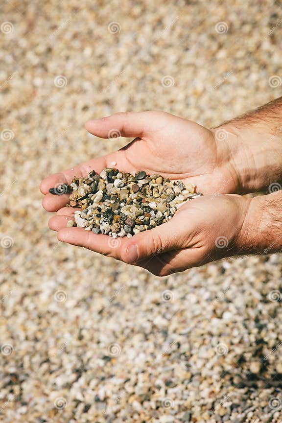 Handful of stones in hands stock photo. Image of harmony - 44935790