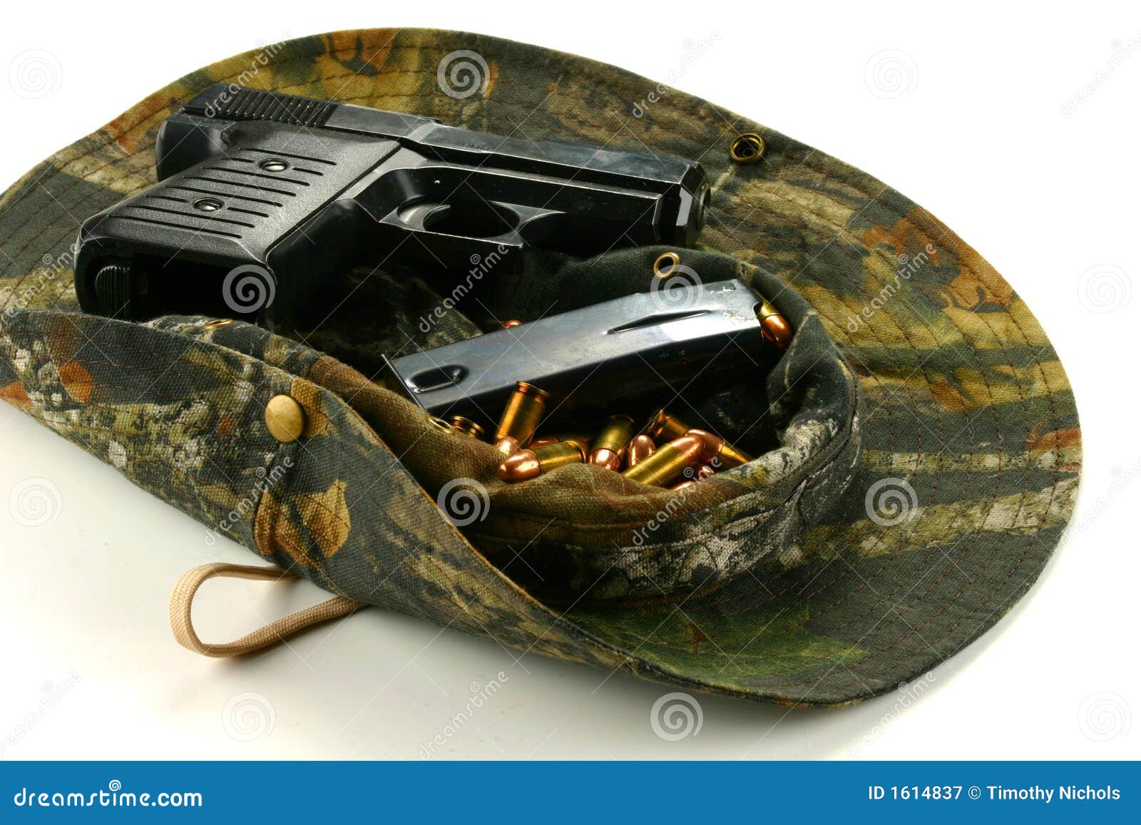 Handgun And Ammo In A Hat Picture. Image: 1614837