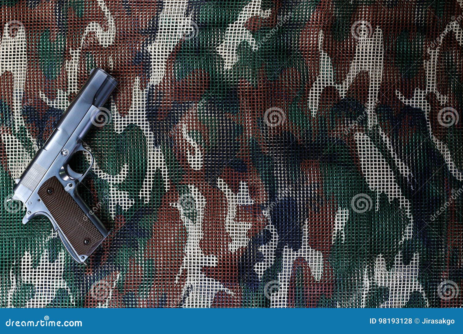 Handgun on Military Camouflage Net Background Stock Photo - Image of ...