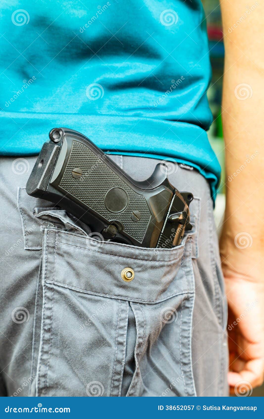 Handgun in pocket stock image. Image of handgun, person - 38652057