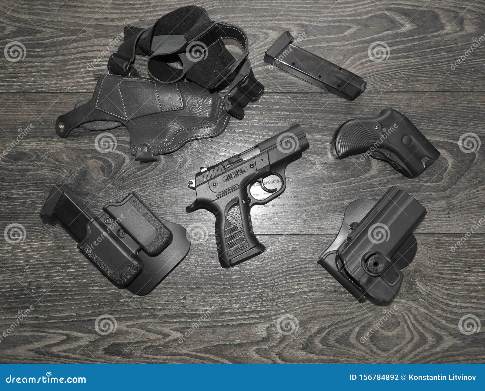 A Handgun is Set on Top of the Table with the Magazing Clips. Stock ...