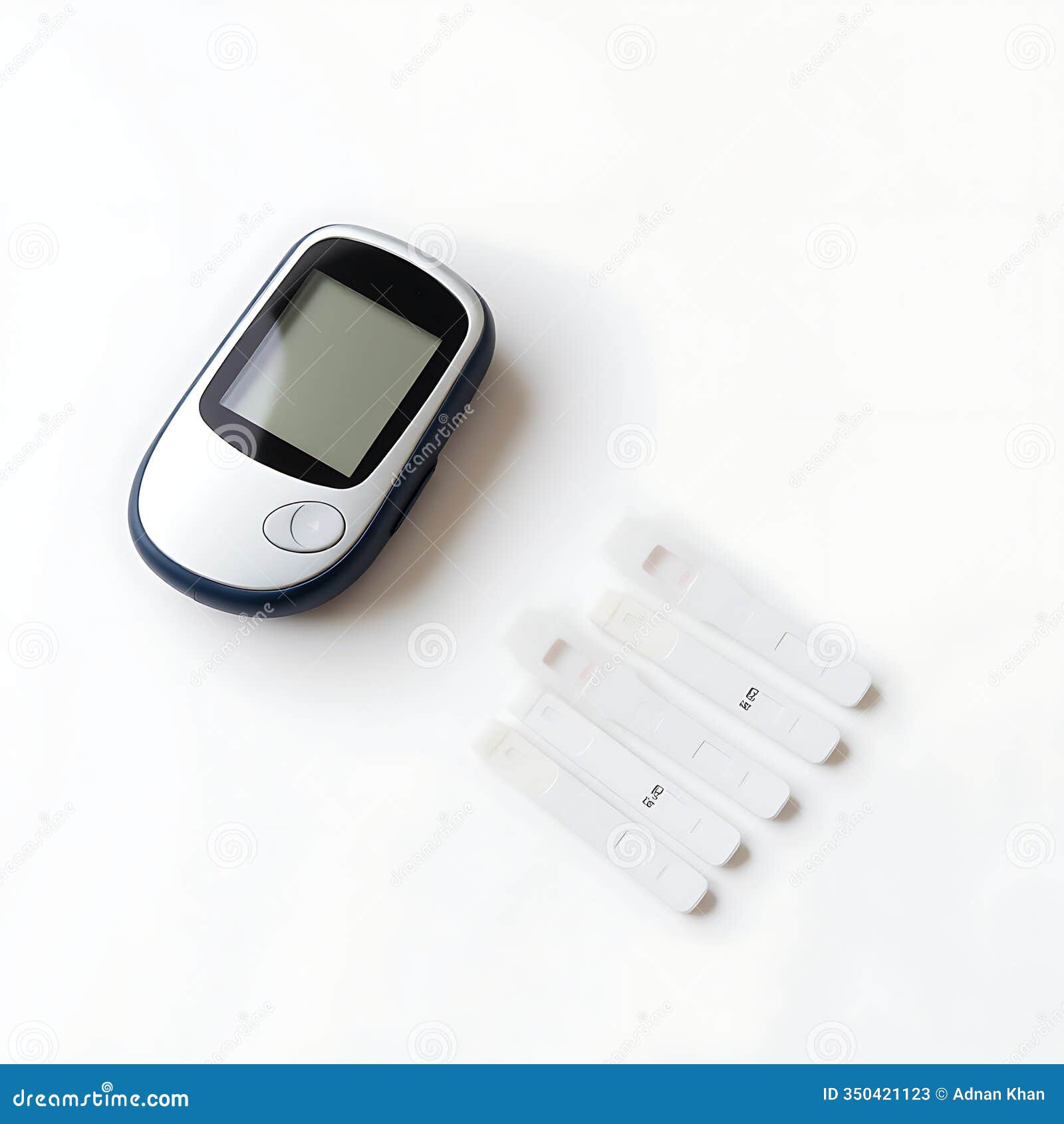 A Handheld Blood Glucose Meter with Test Strips Arranged on a White ...