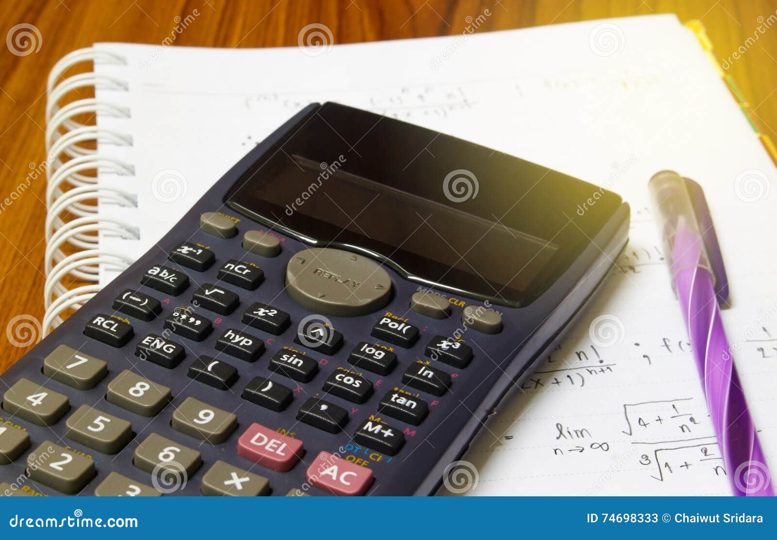Handheld Calculator on a Sheet of Paper Stock Image - Image of handheld ...