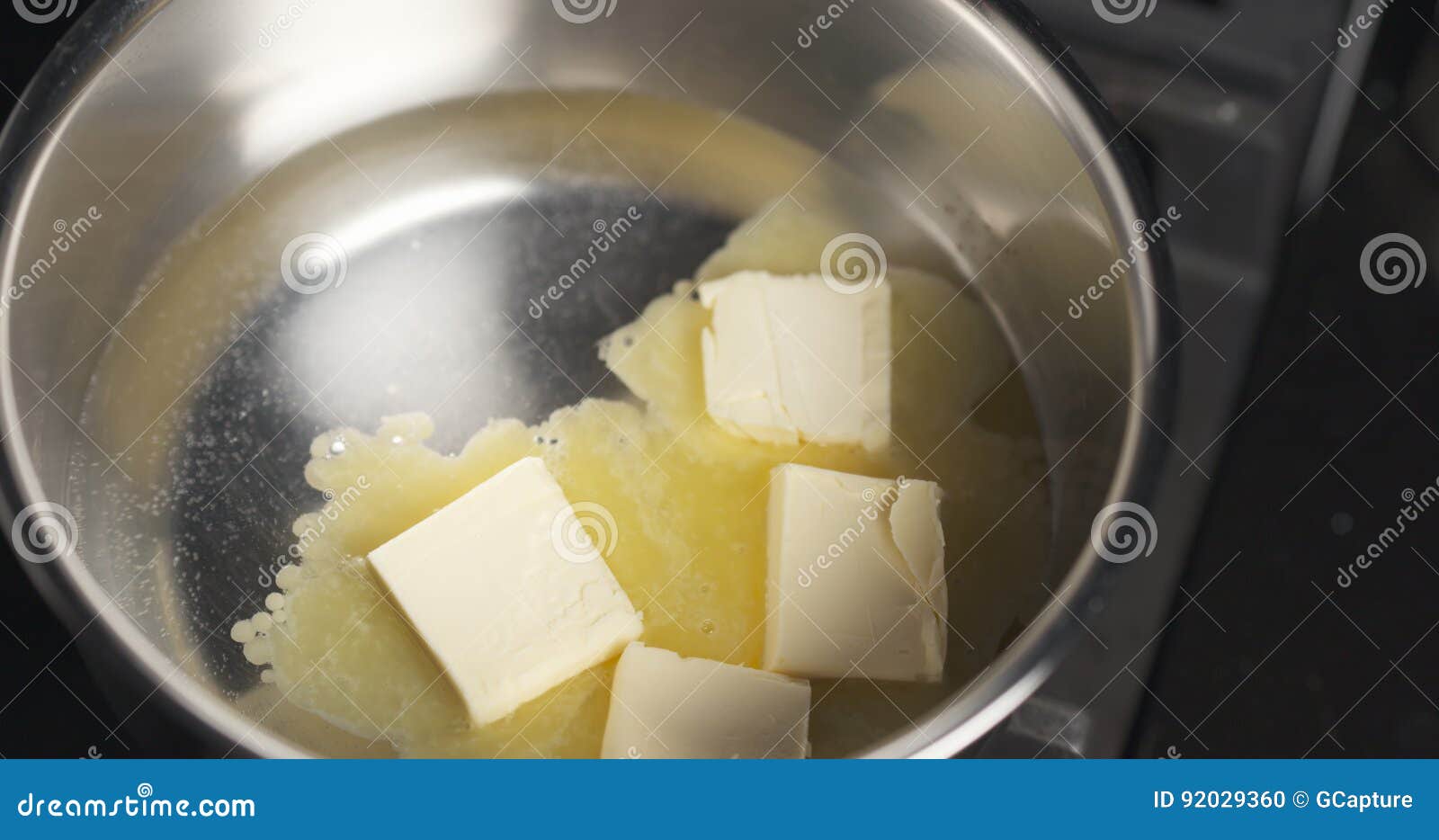 Handheld Shot of Butter Melting in Water Stock Photo - Image of butter ...