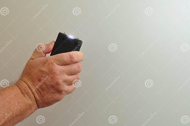 A handheld taser stock image. Image of white, protection - 71385443