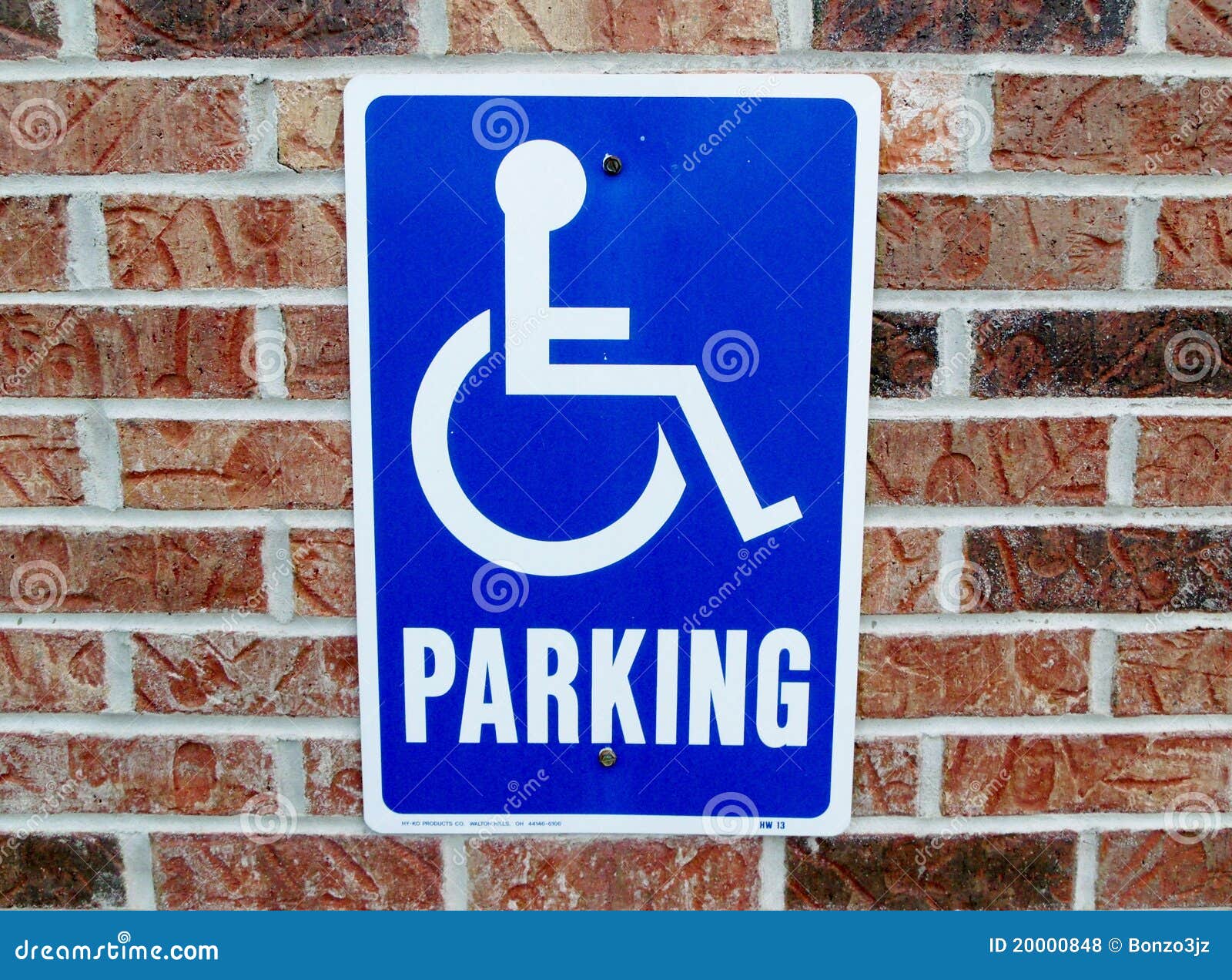 Handicap Parking Sign on Brick Wall Stock Photo - Image of ...