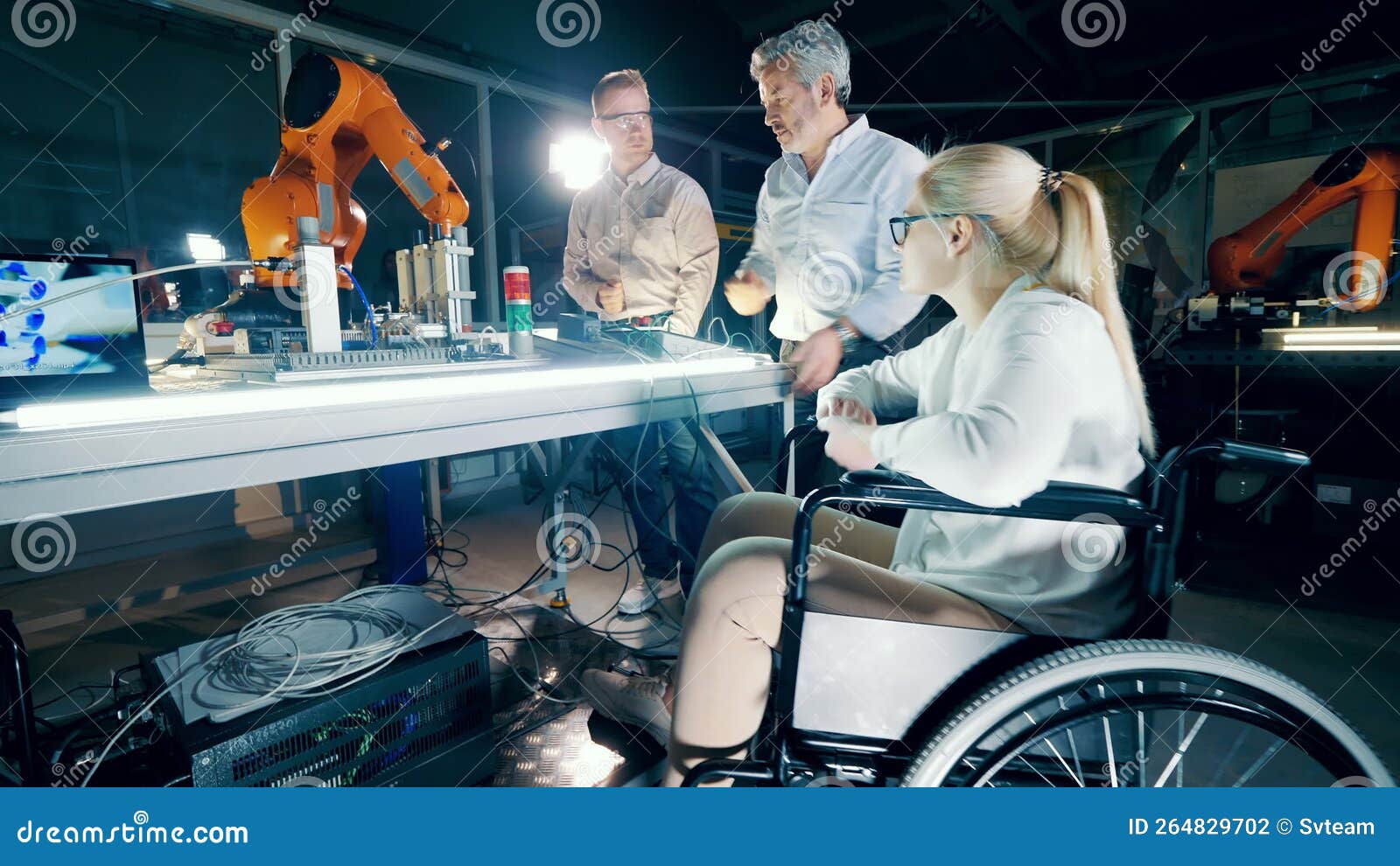 Disabled Engineer and Her Colleagues Working in the Robotics Lab Stock ...