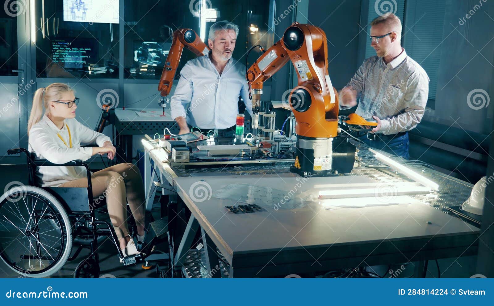 Disabled Engineer and Her Coworkers are Examining Robots Stock Footage ...