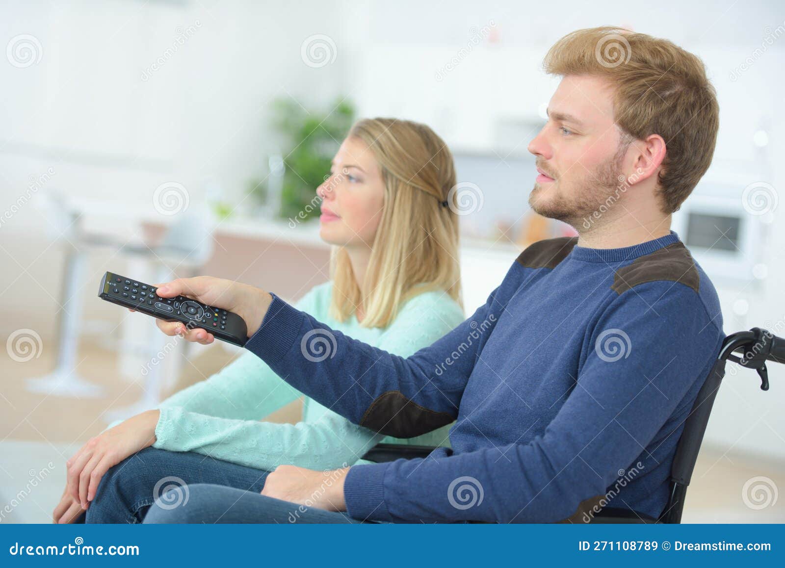 Handicapped Man Using Remote Control while Watching Tv Stock Image ...