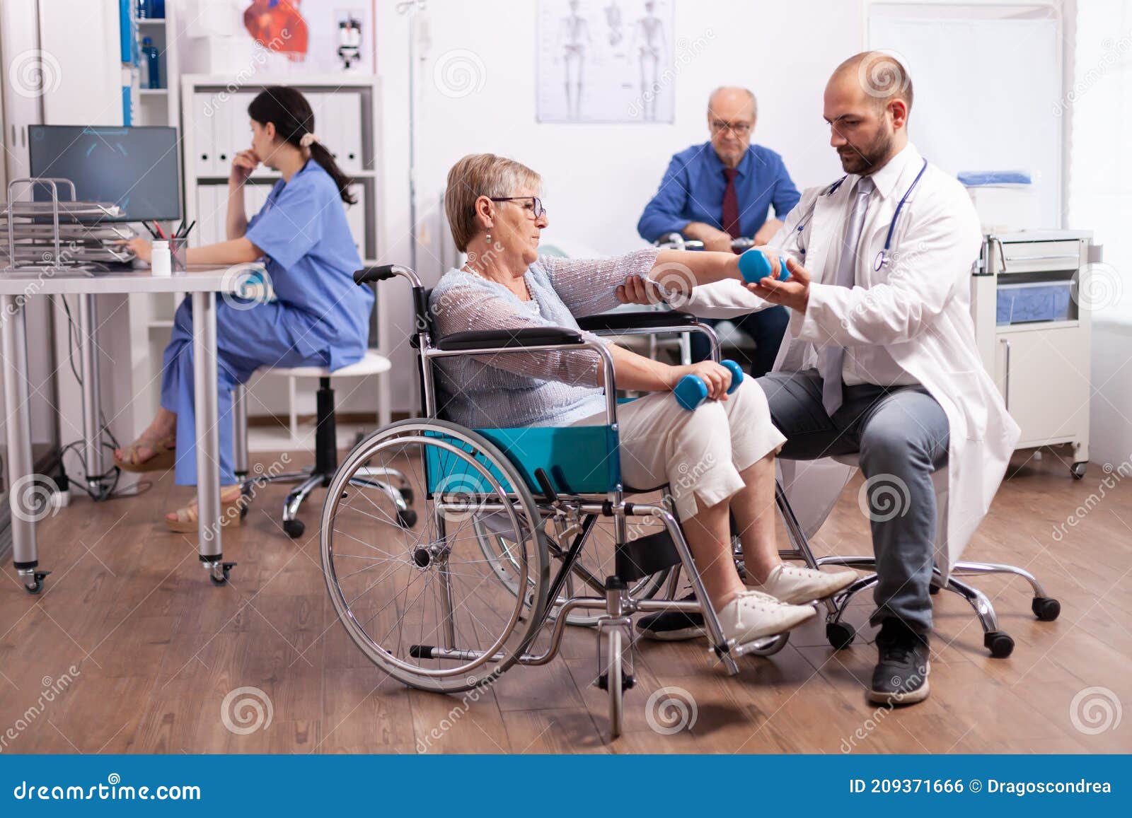 Handicapped Patient Getting Help from Physical Therapist Stock Photo ...