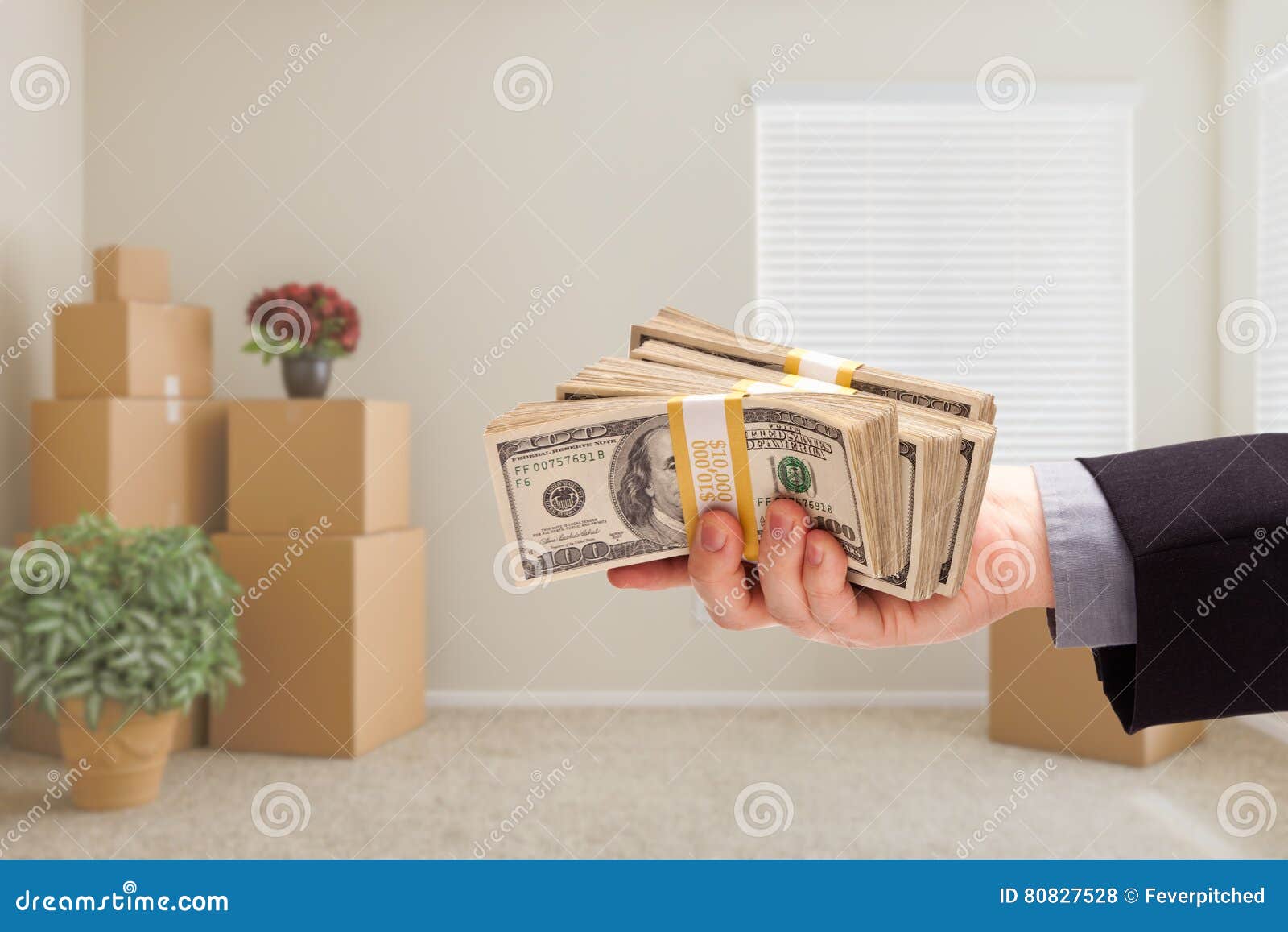 Handing Over Cash in Room with Packed Moving Boxes Stock Photo - Image ...