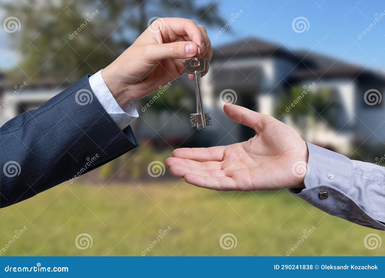 Handing Over the House Keys in Front of a Beautiful New Home. Stock ...