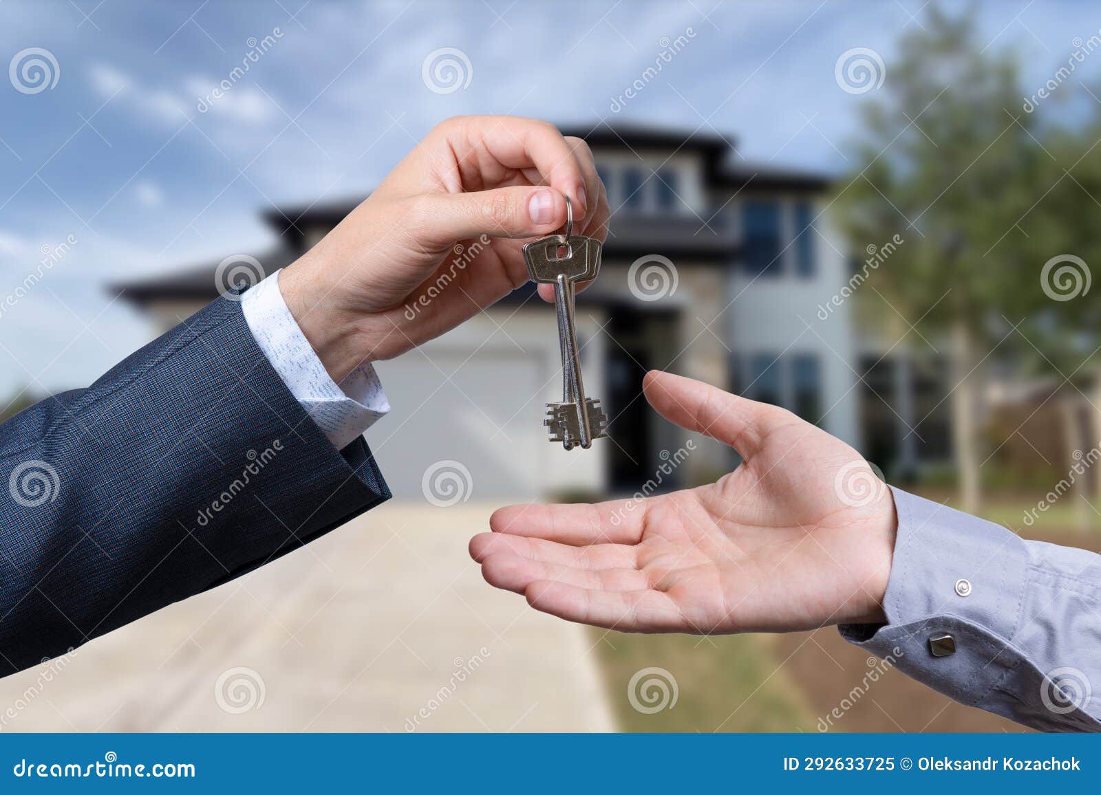 Handing Over the House Keys in Front of a Beautiful New Home. Stock ...