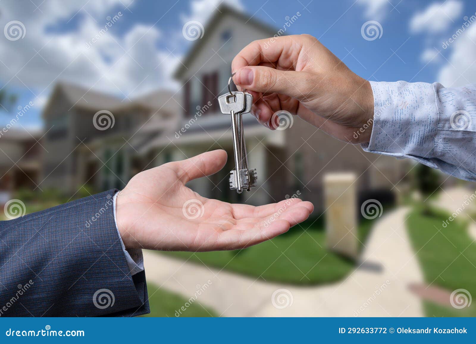 Handing Over the House Keys in Front of a Beautiful New Home. Stock ...