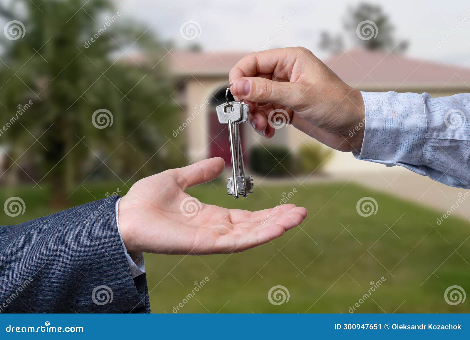 Handing Over the House Keys in Front of a Beautiful New Home. Stock ...