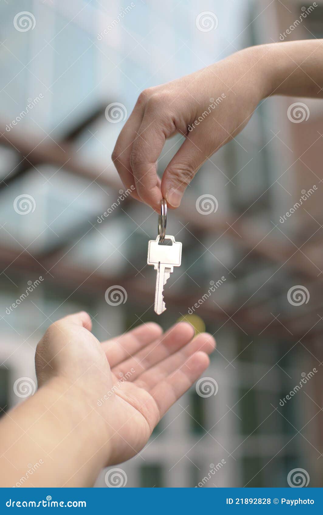 Handing Over the Key stock photo. Image of property, keychain - 21892828