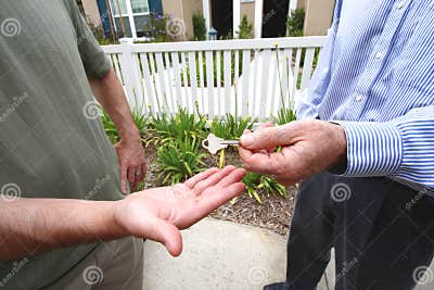 Handing Over the Key stock image. Image of daytime, home - 5303759