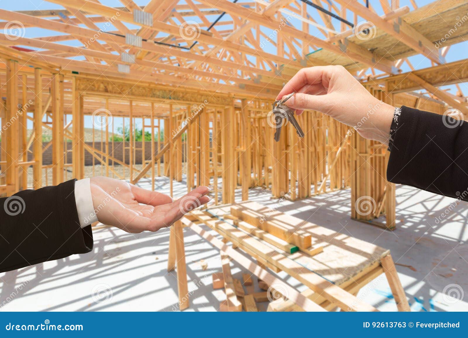 Handing Over the Keys on Site Inside New Home Construction Framing ...