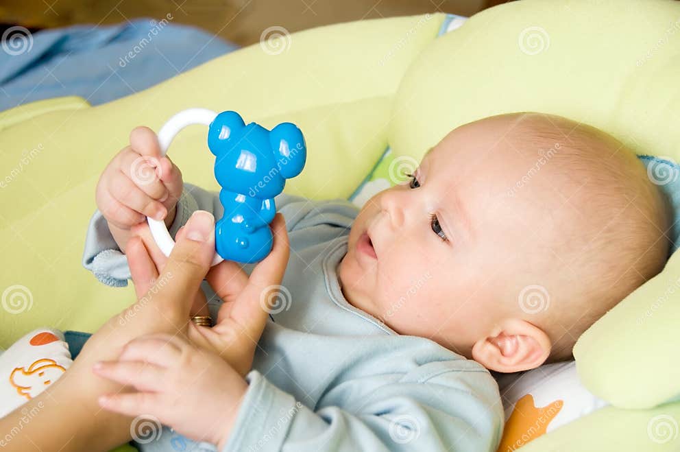 Handing a toy stock photo. Image of childhood, baby, infant - 7381760