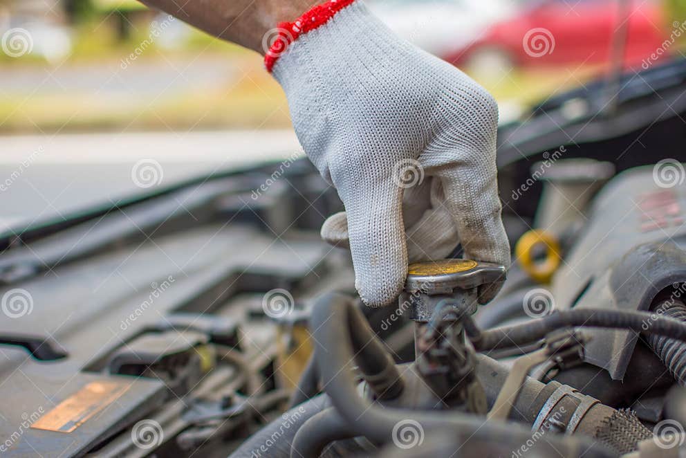 Hand Twisted Car Radiator Cap Stock Image - Image of hand, level: 183121703