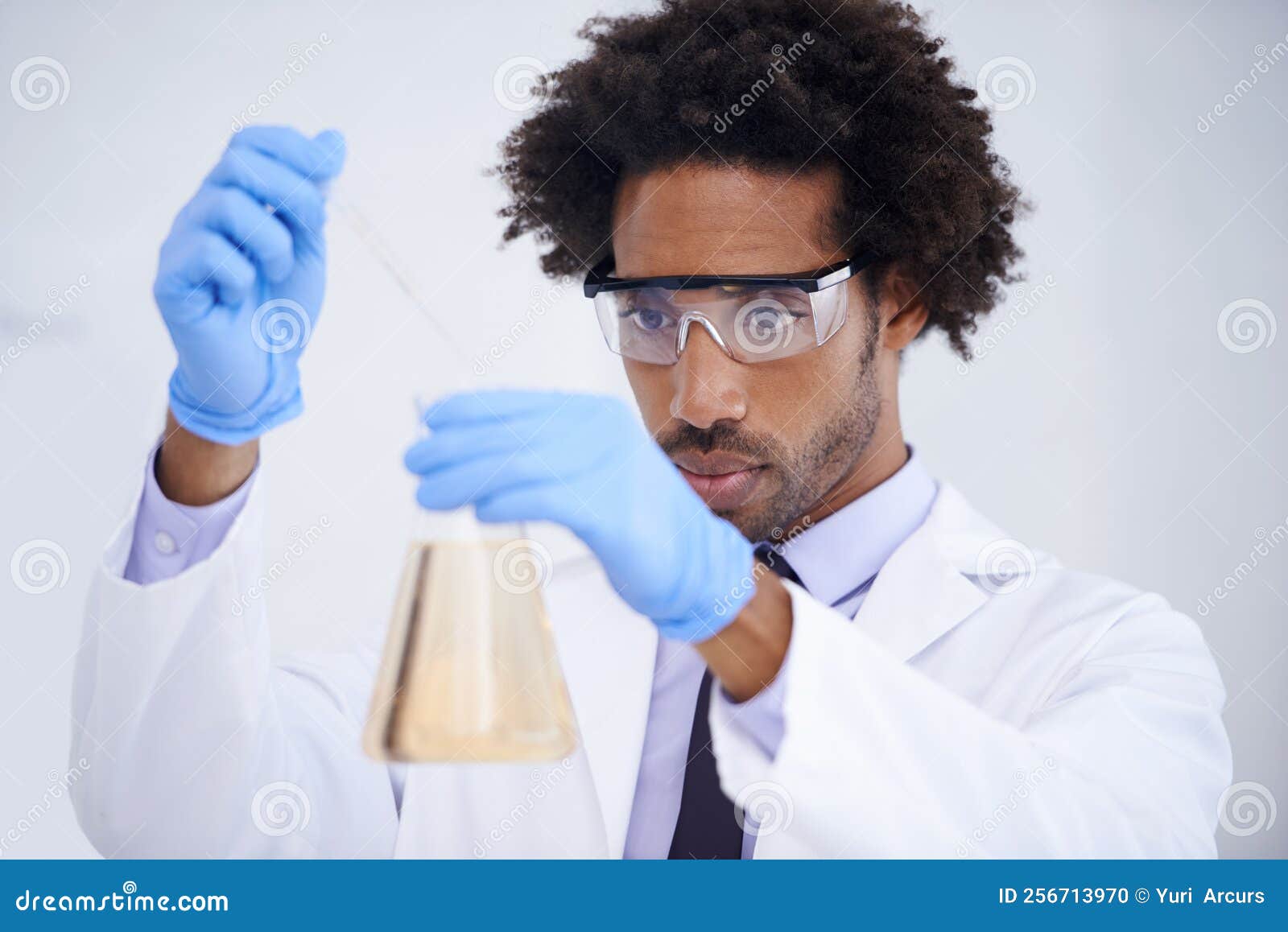 Handle with Care. a Handsome Male Scientist Conducting an Experiment in ...