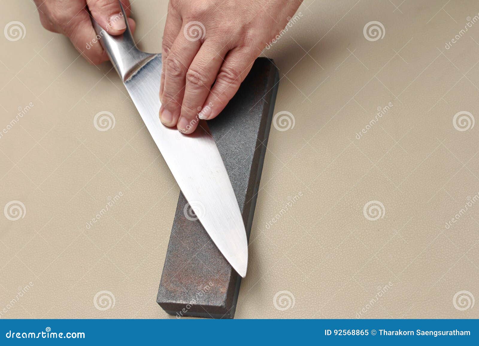 Handle the Knife To Make a Sharp Knife with a Whetstone. Stock Image ...