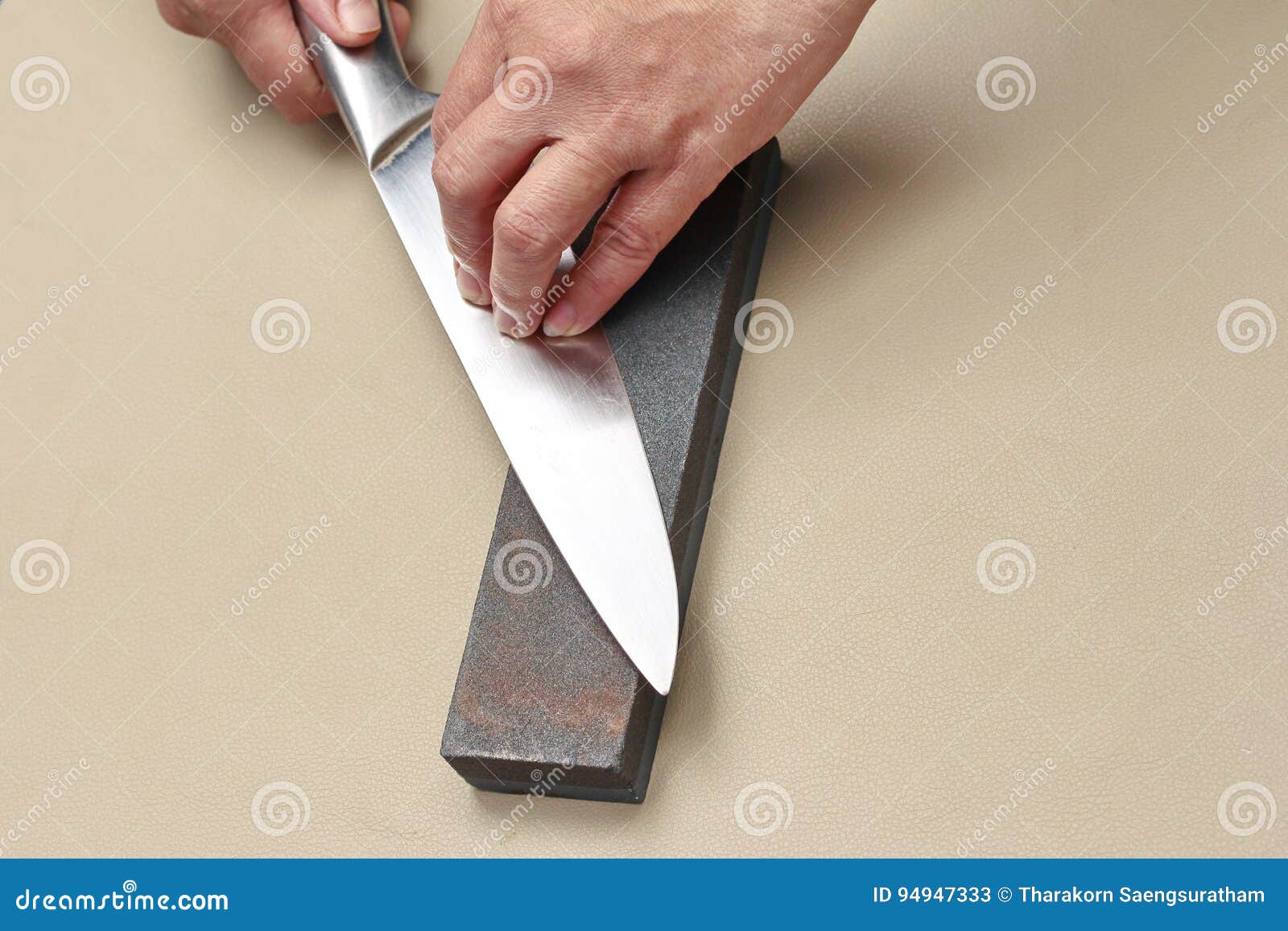 Handle the Knife To Make a Sharp Knife with a Whetstone. Stock Image ...
