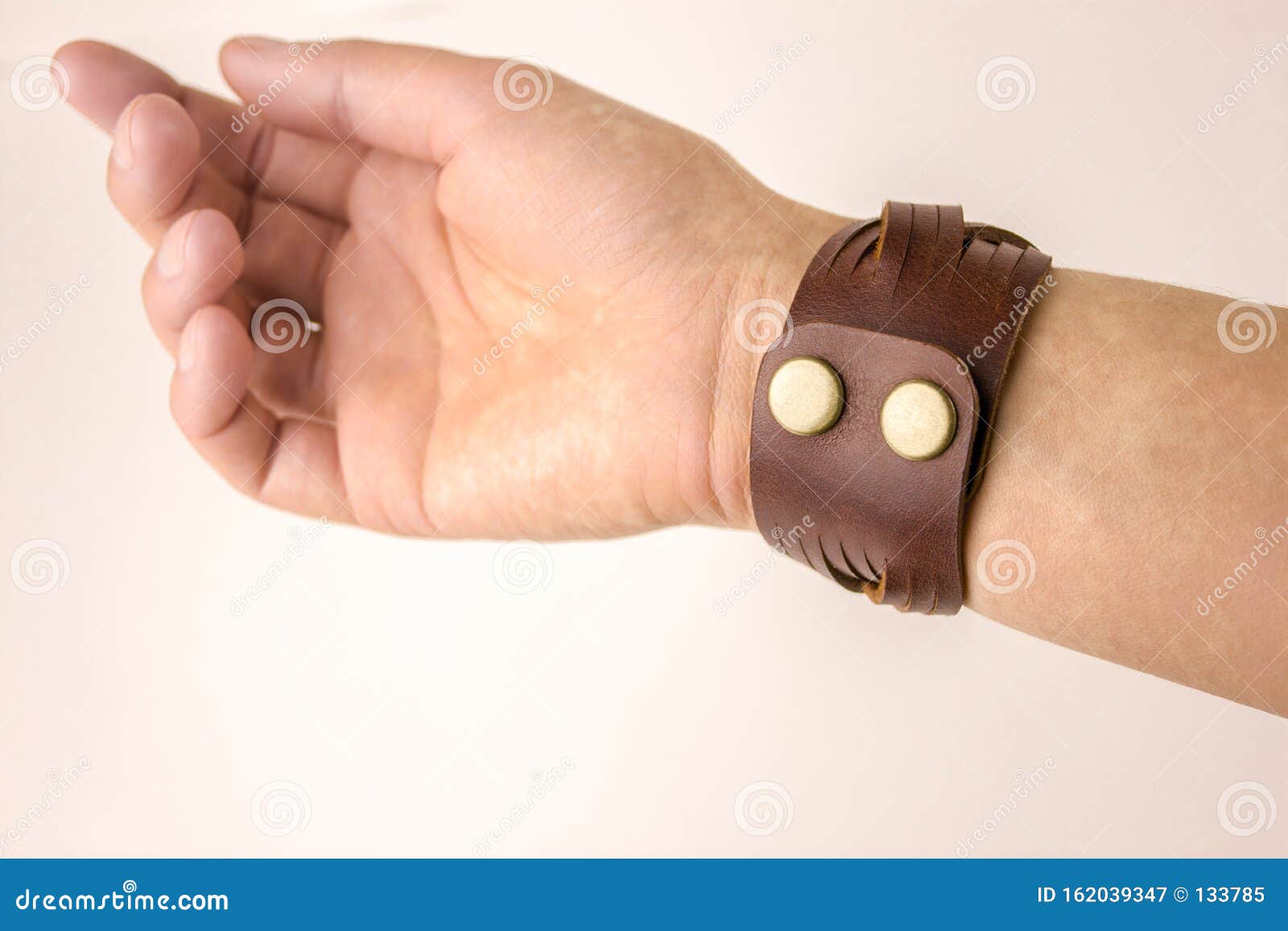 Handmade Brown Leather Woven Bracelet with Rivets on the Wrist Stock ...