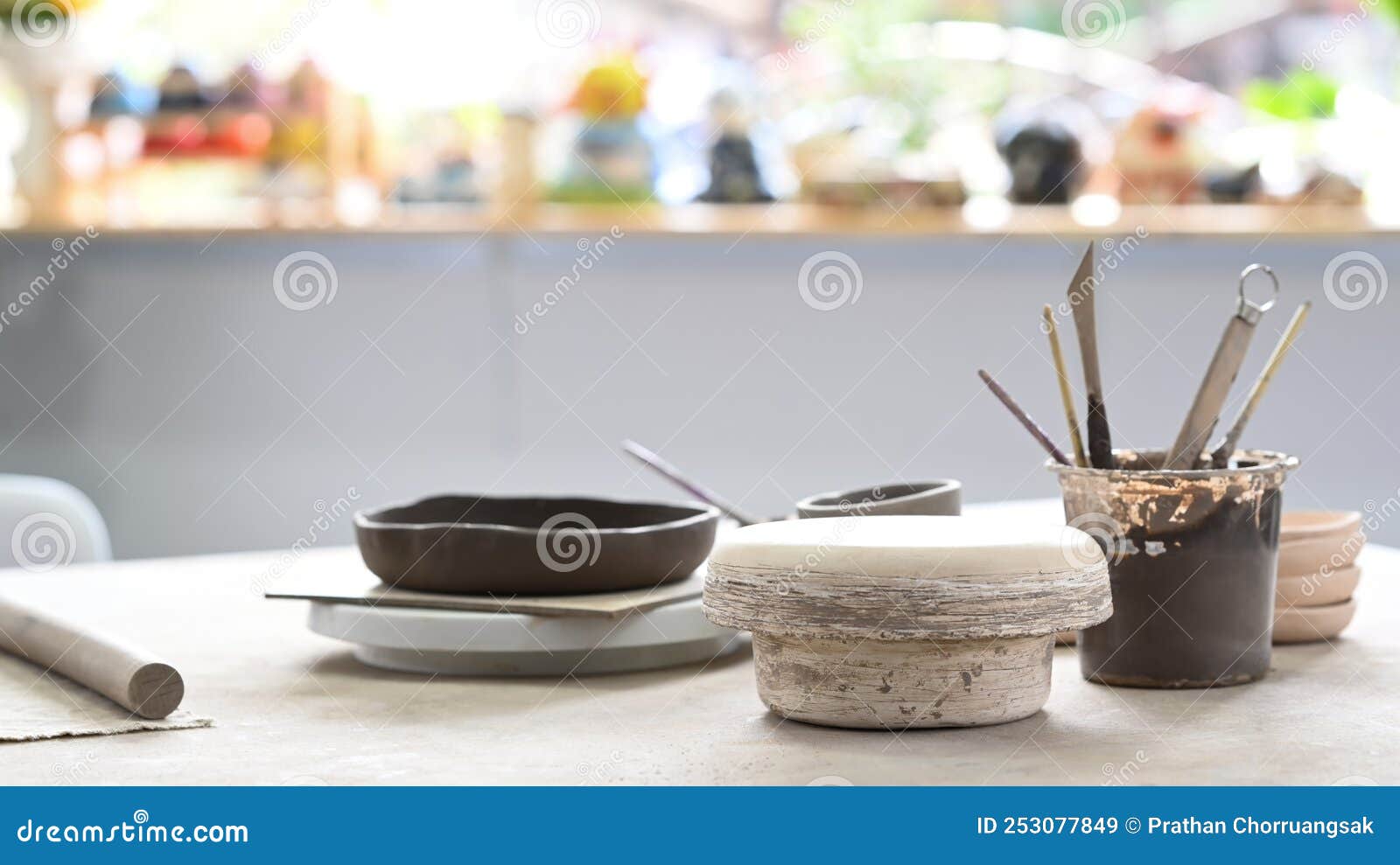 Handmade Ceramic Dish Ware and Pottery Shaping Tools on Stone Table in ...