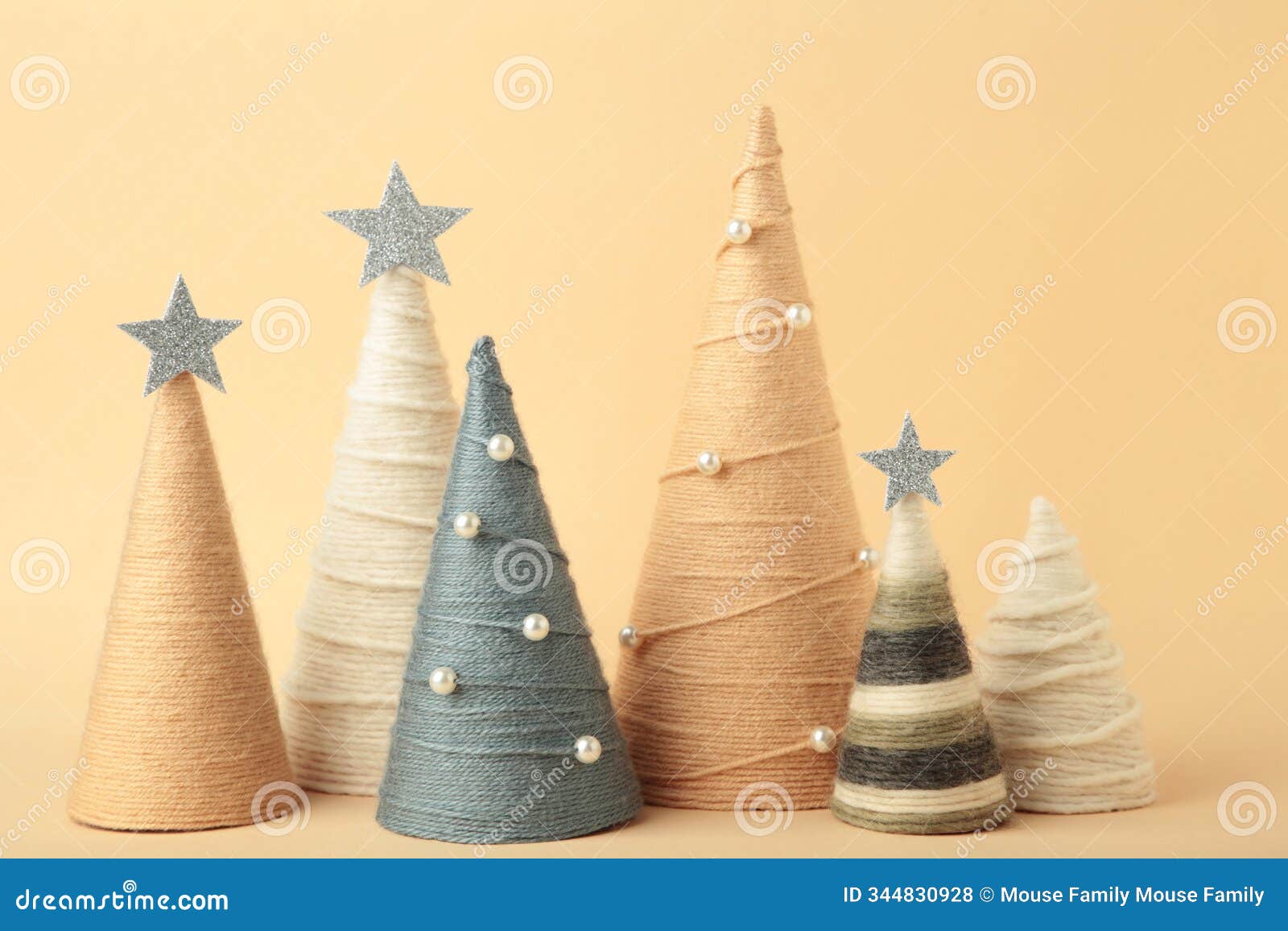 Handmade Christmas Trees on Beige Background. Yarn Wrapped Cone Trees ...