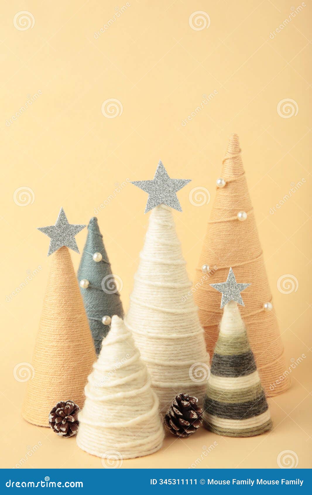 Handmade Christmas Trees on Beige Background. Yarn Wrapped Cone Trees ...