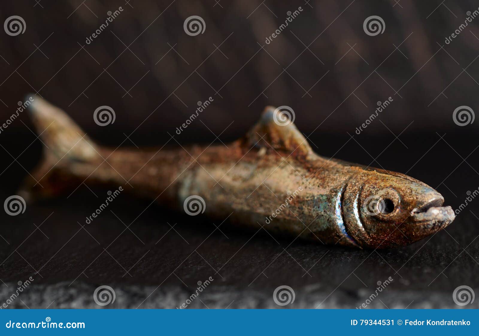 Handmade clay fish on wood stock image. Image of texture - 79344531